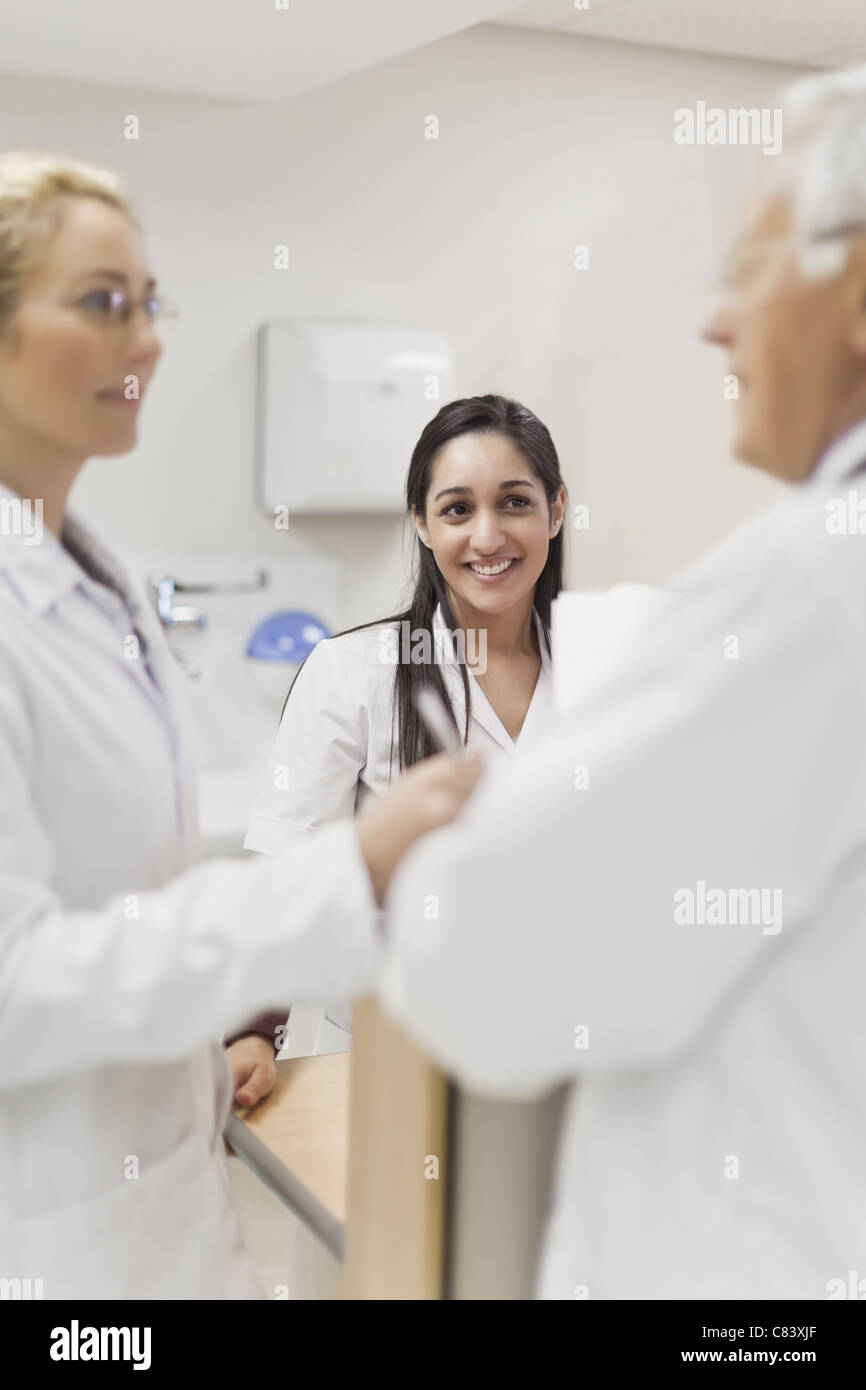 Group doctors speaking together hi-res stock photography and images - Alamy