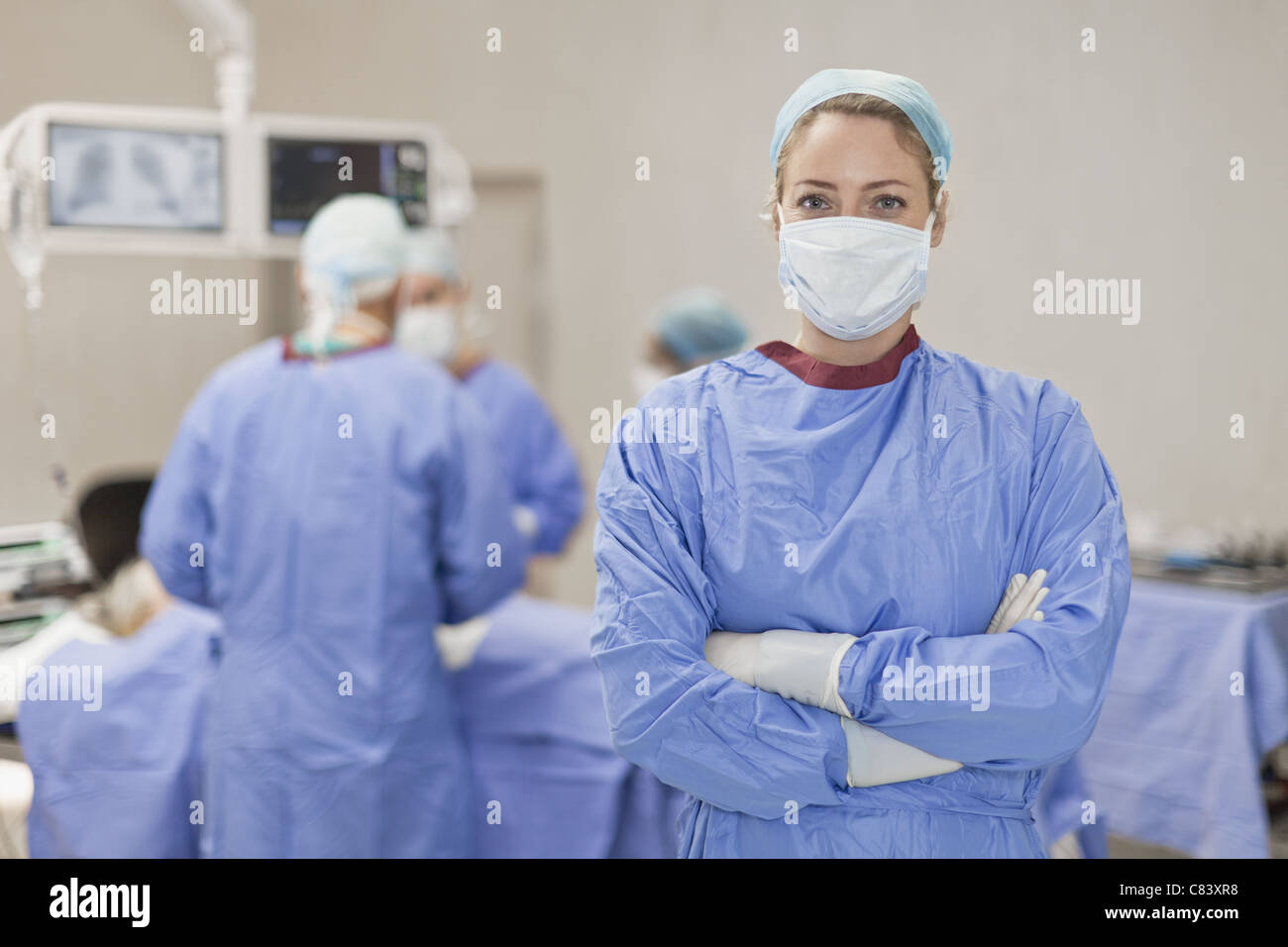 Doctor standing in operating room Stock Photo - Alamy