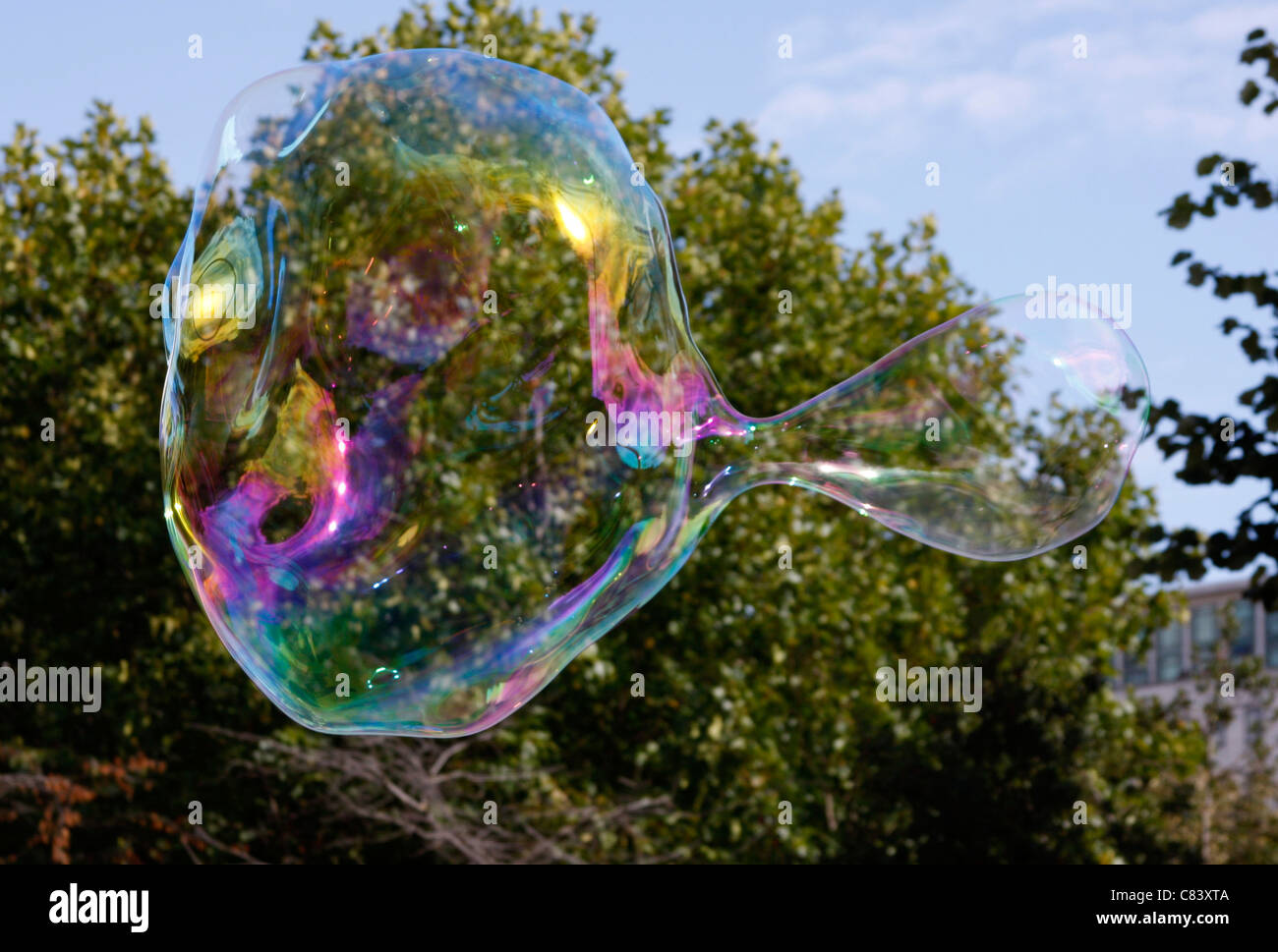 Large strange shaped bubble blown by entertainer on London's South Bank ...