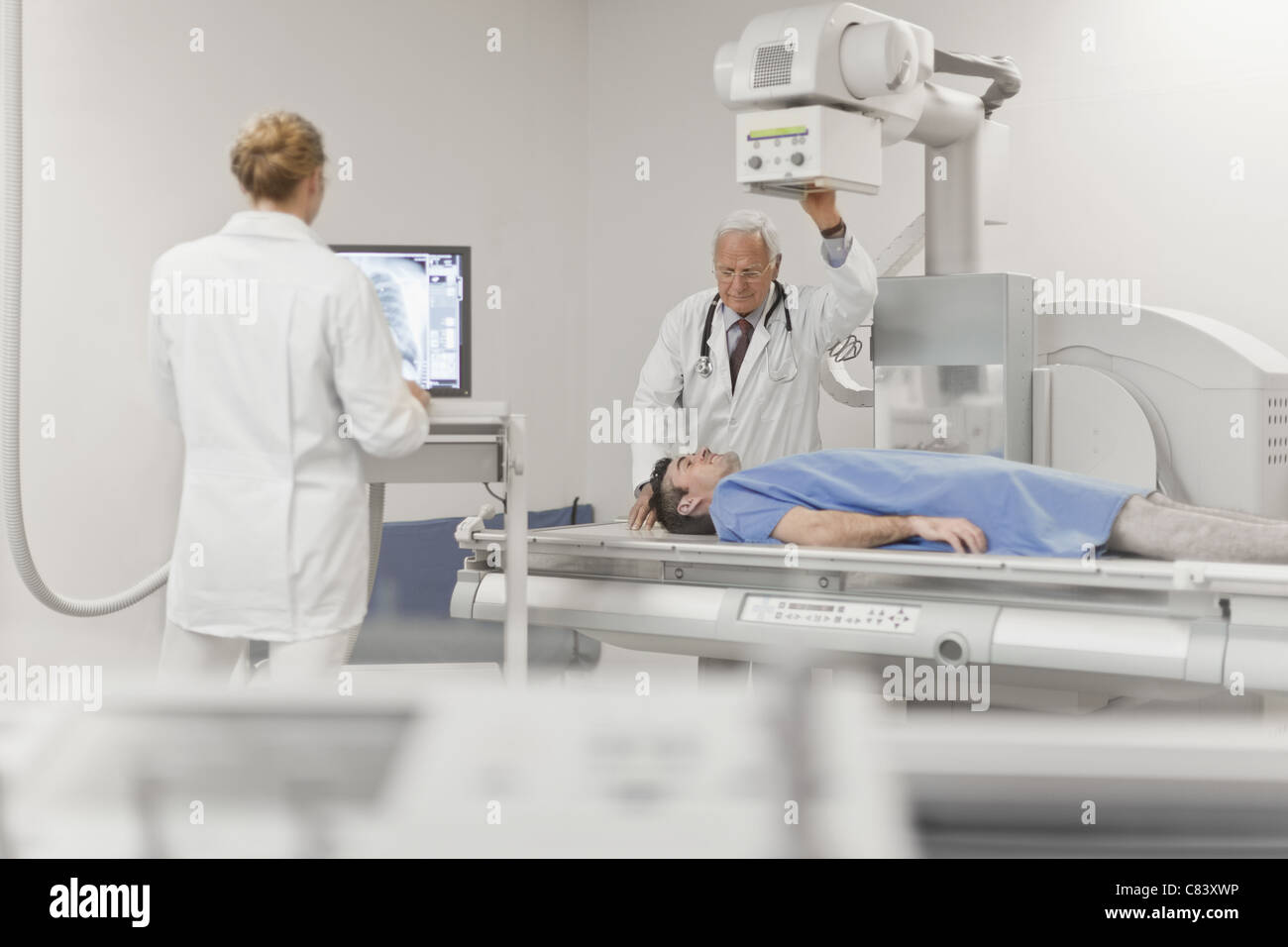 Doctors taking x-rays of patient Stock Photo - Alamy