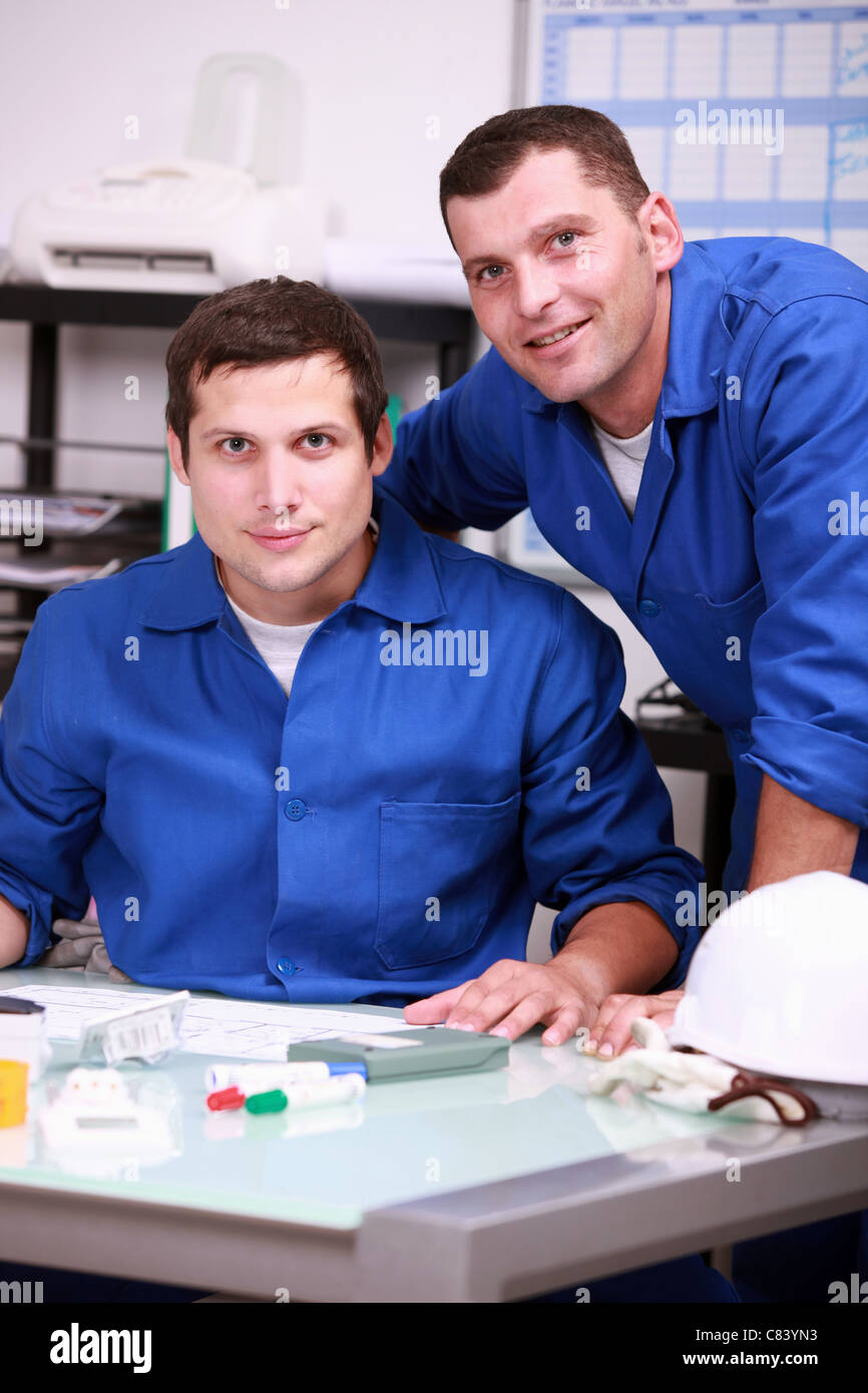 Two warehouse workers taking inventory Stock Photo - Alamy