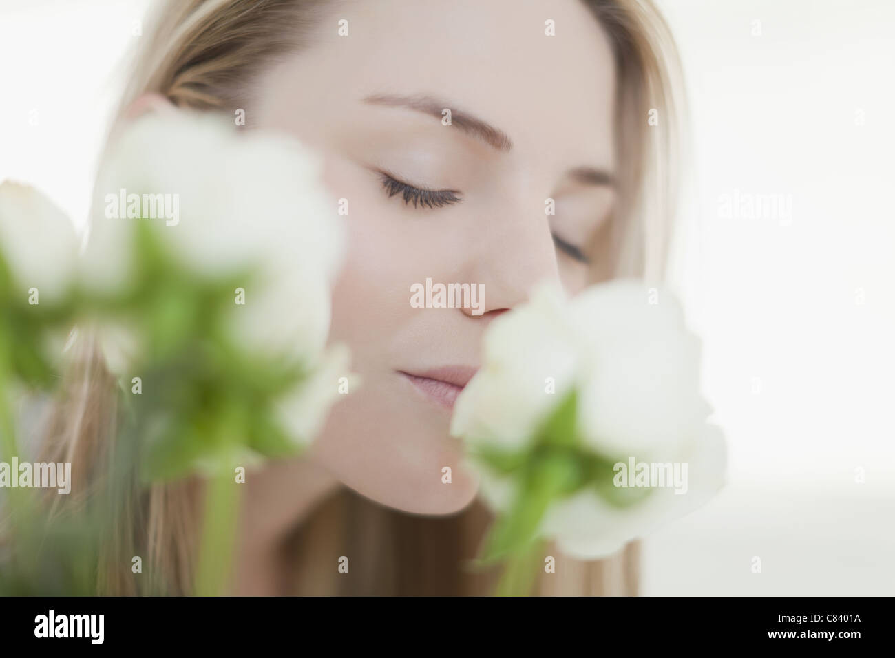 Woman sniffing flowers on blooming hi-res stock photography and images ...
