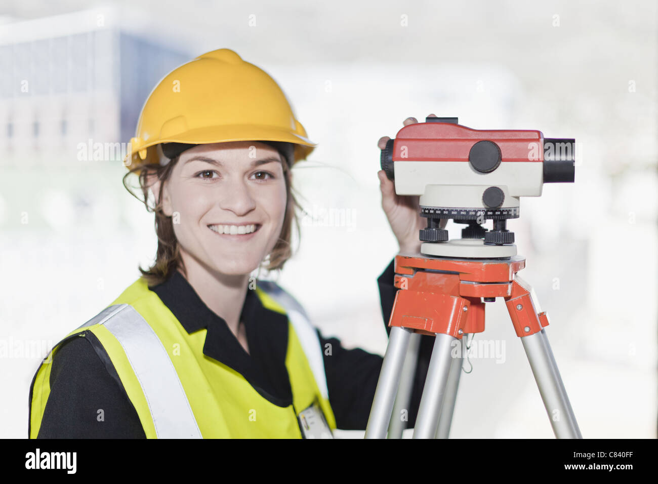 Worker using equipment on site Stock Photo - Alamy