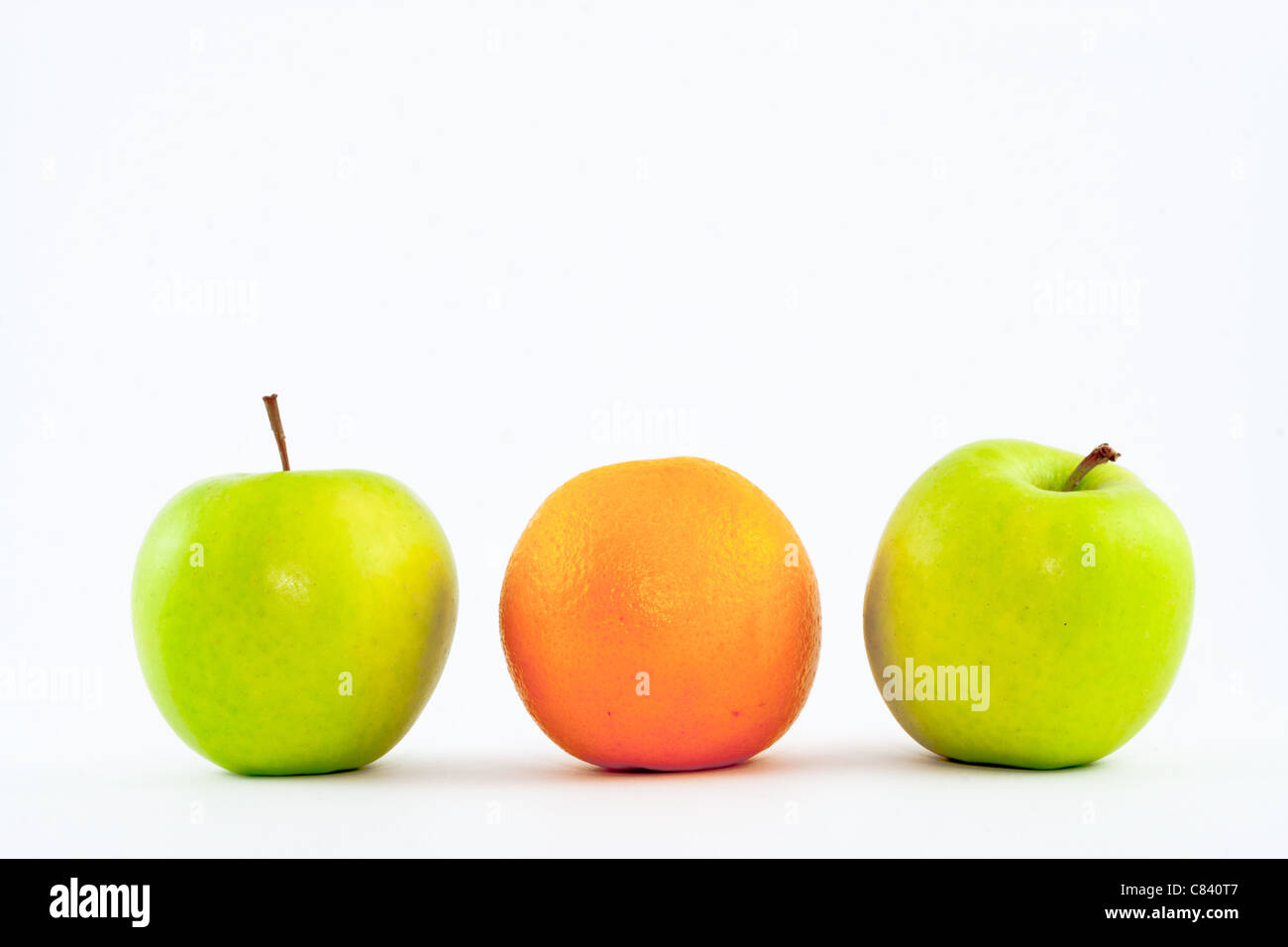 Two apples and orange isolated on white background Stock Photo - Alamy