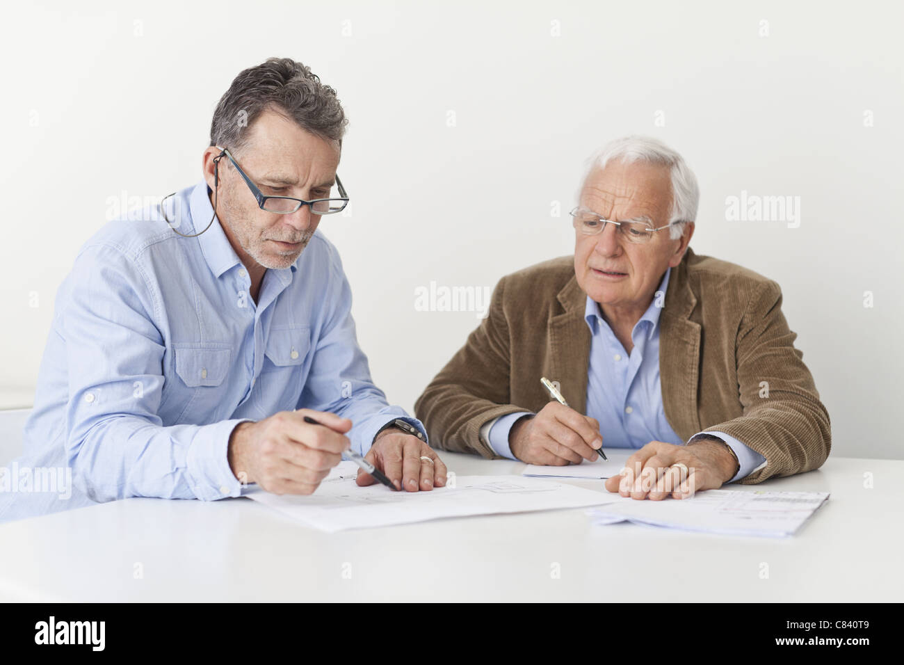 Businessmen talking in meeting Stock Photo - Alamy