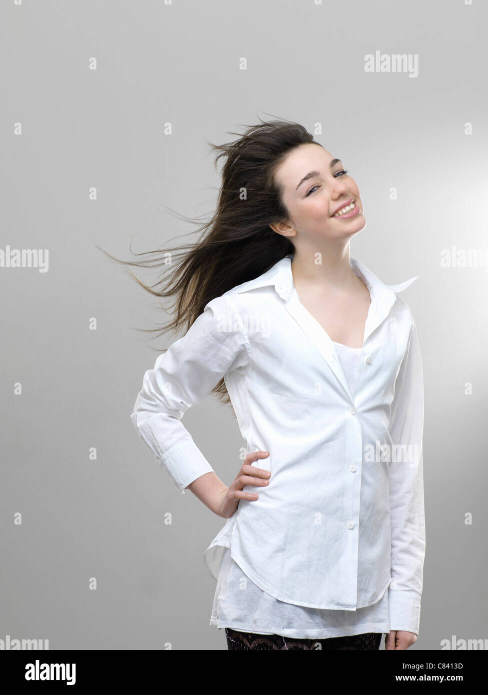 Smiling girl’s hair blowing in wind Stock Photo - Alamy