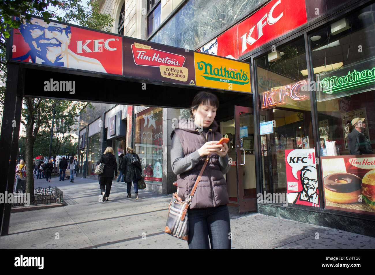 Signs for an assortment of fast food franchises located in one ...