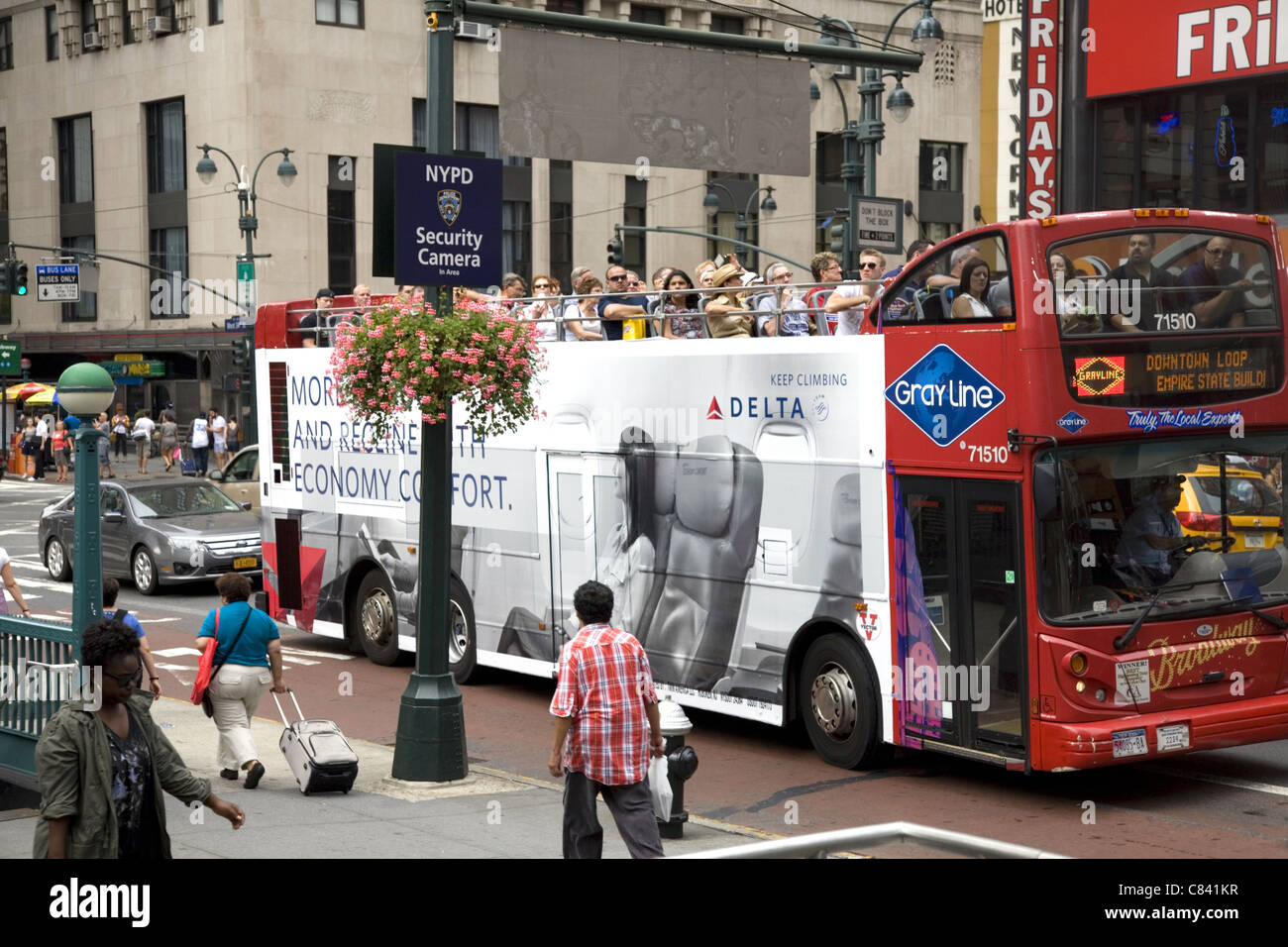 Sightseeing tour bus runs along 34th Street in Manhattan Stock Photo ...