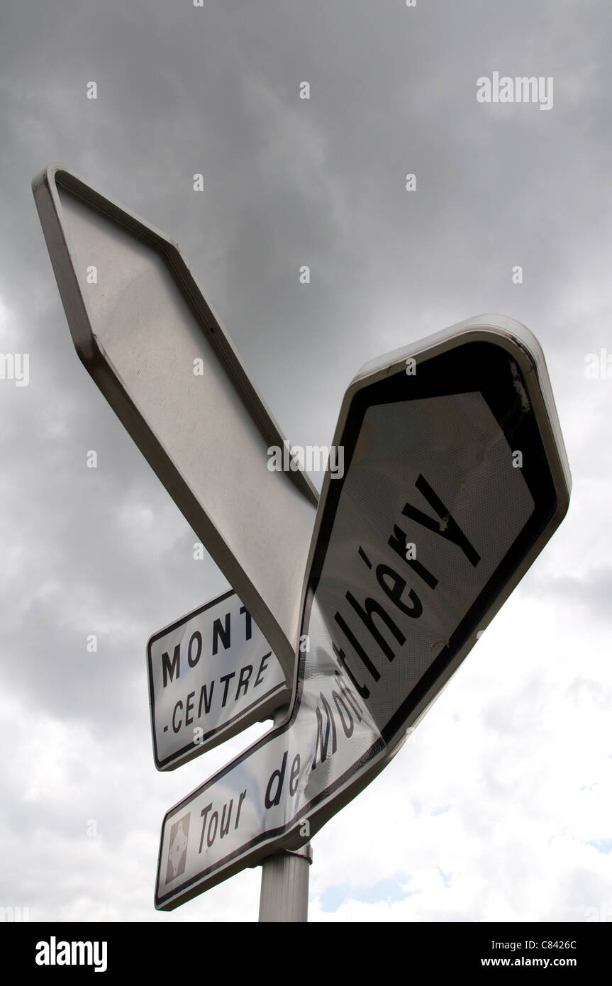 This twisted and damaged road sign in France has obviously been ...
