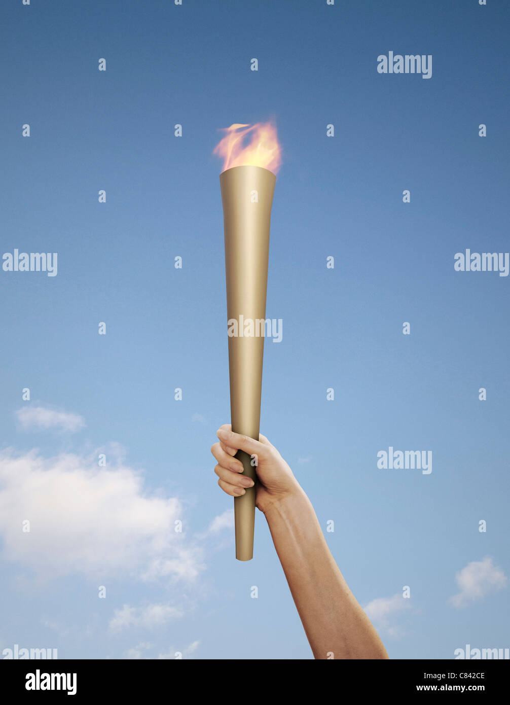 Hand holding flaming baton Stock Photo - Alamy