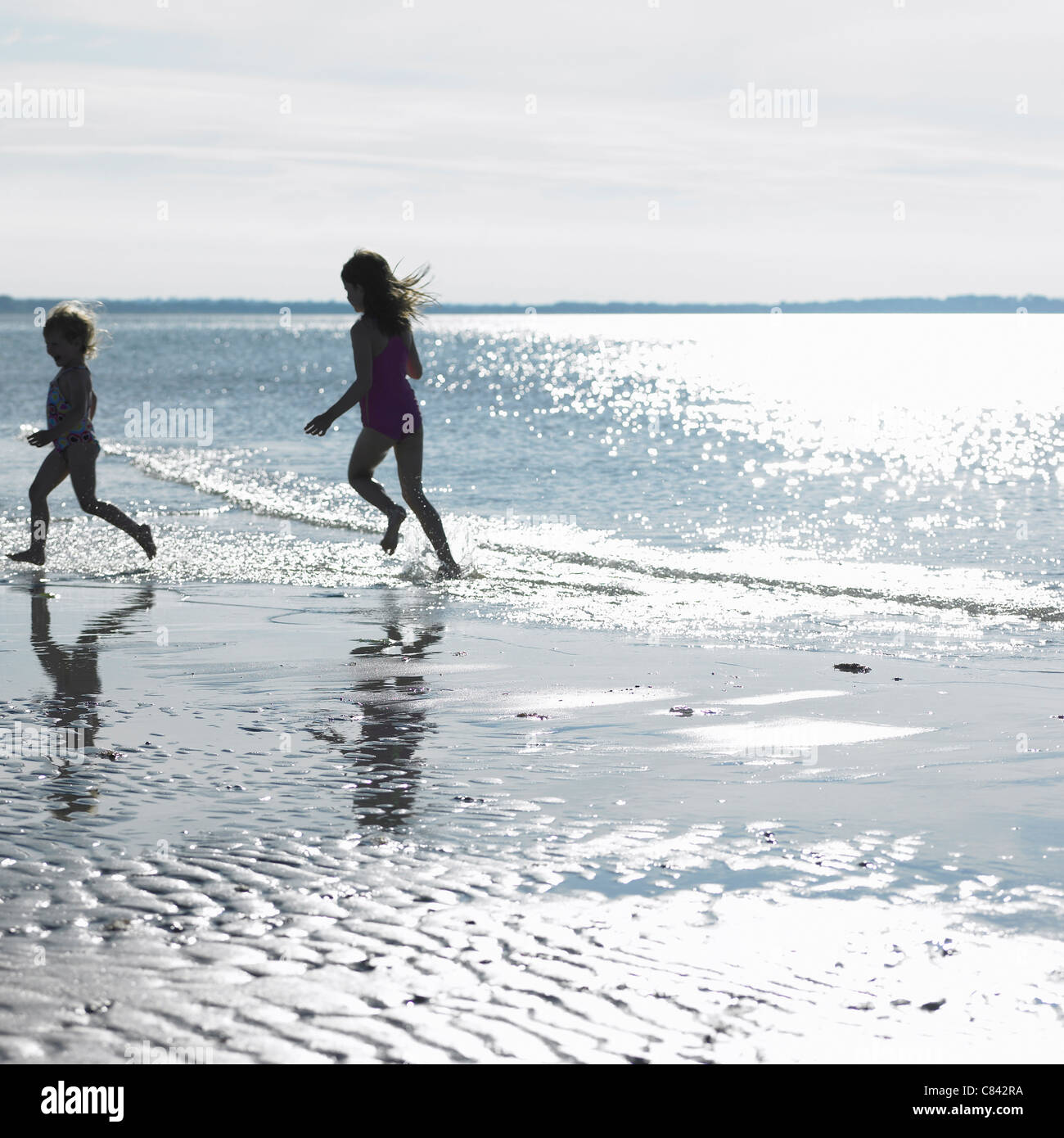Girl Girls Waves High Resolution Stock Photography and Images - Alamy