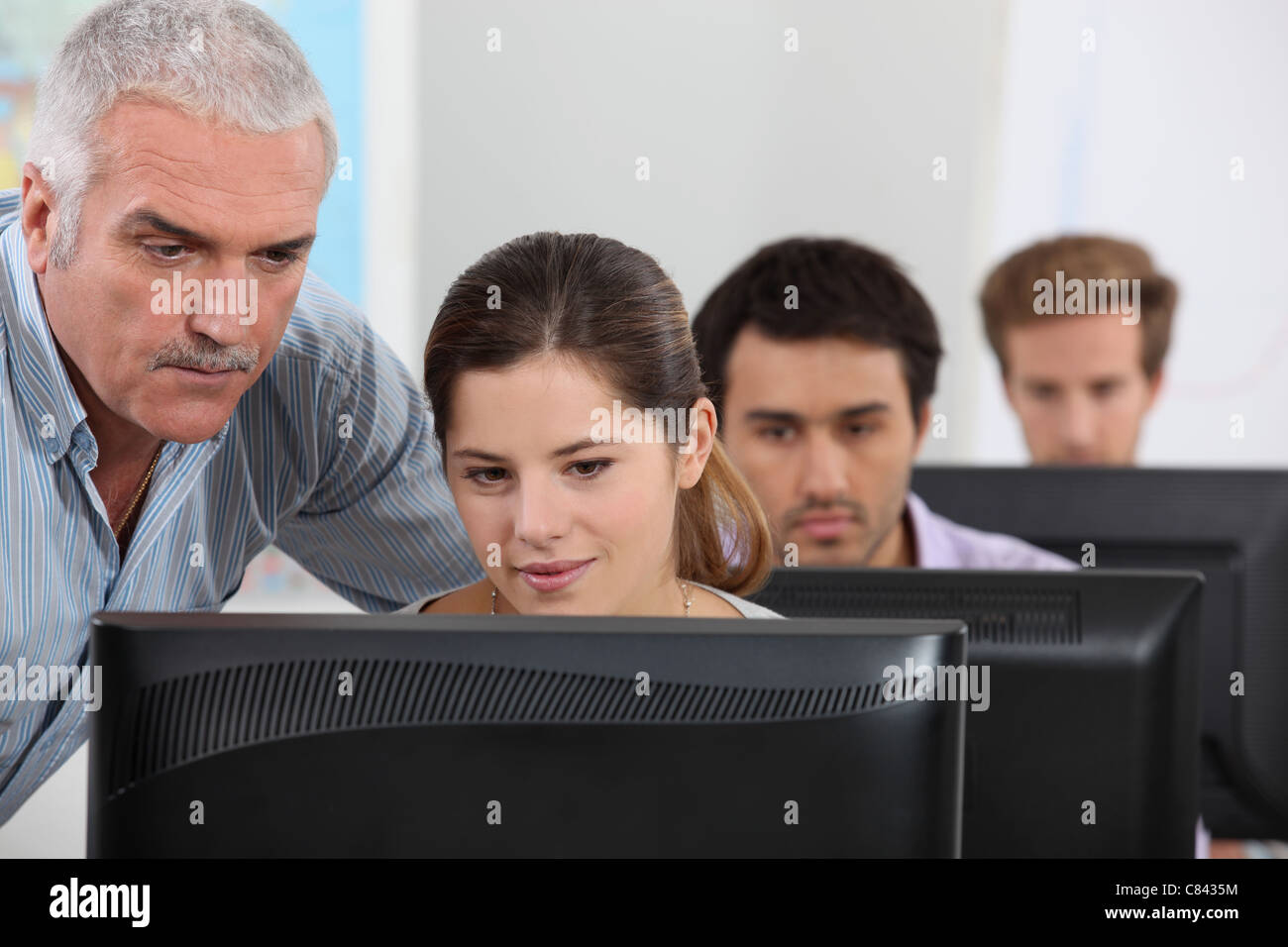 An IT teacher giving a class Stock Photo - Alamy