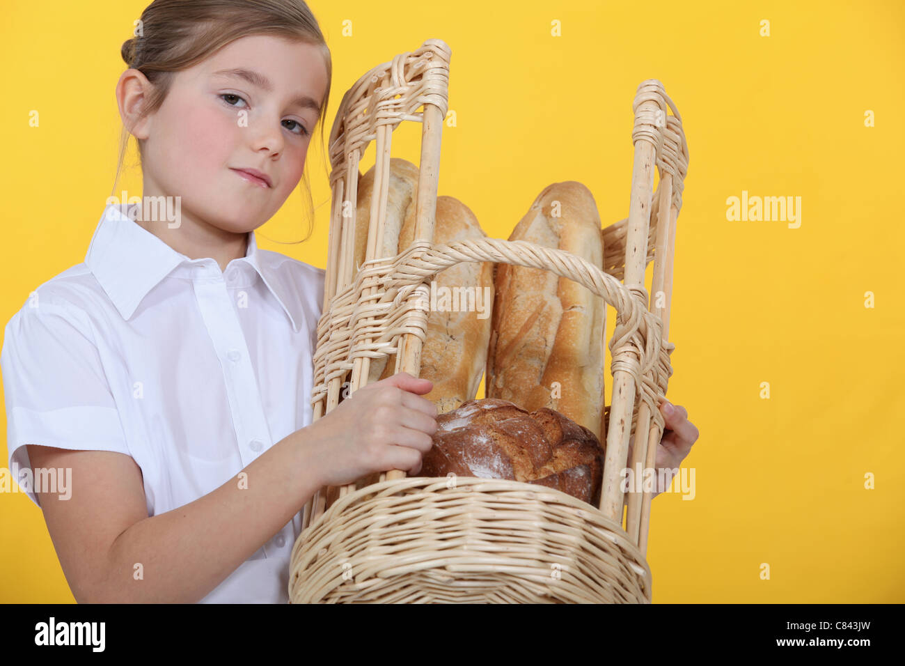 Young girl dressed as a baker Stock Photo - Alamy