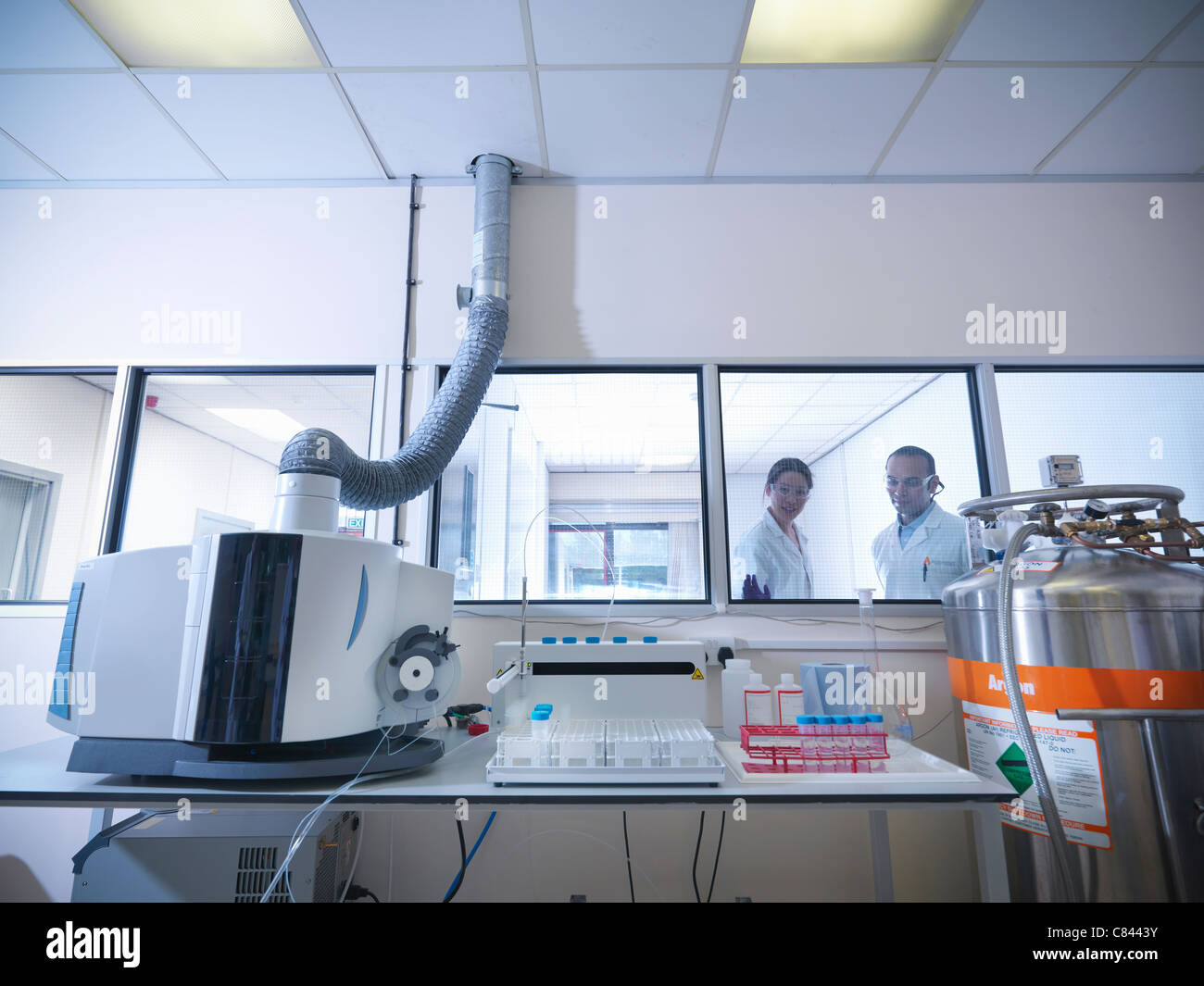 Scientists Working With Equipment High Resolution Stock Photography and ...