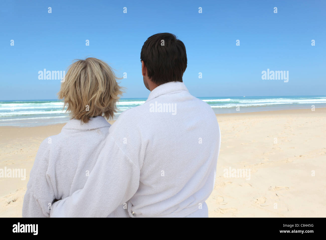 couple looking at the beach Stock Photo - Alamy