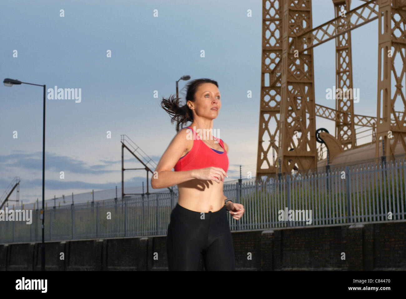 Runner jogging on city street Stock Photo - Alamy