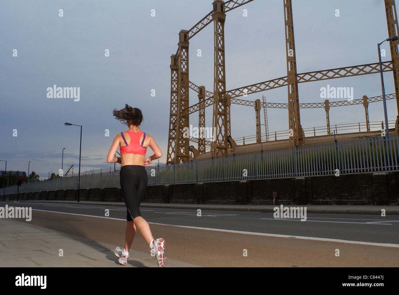 Runner jogging on city street Stock Photo - Alamy