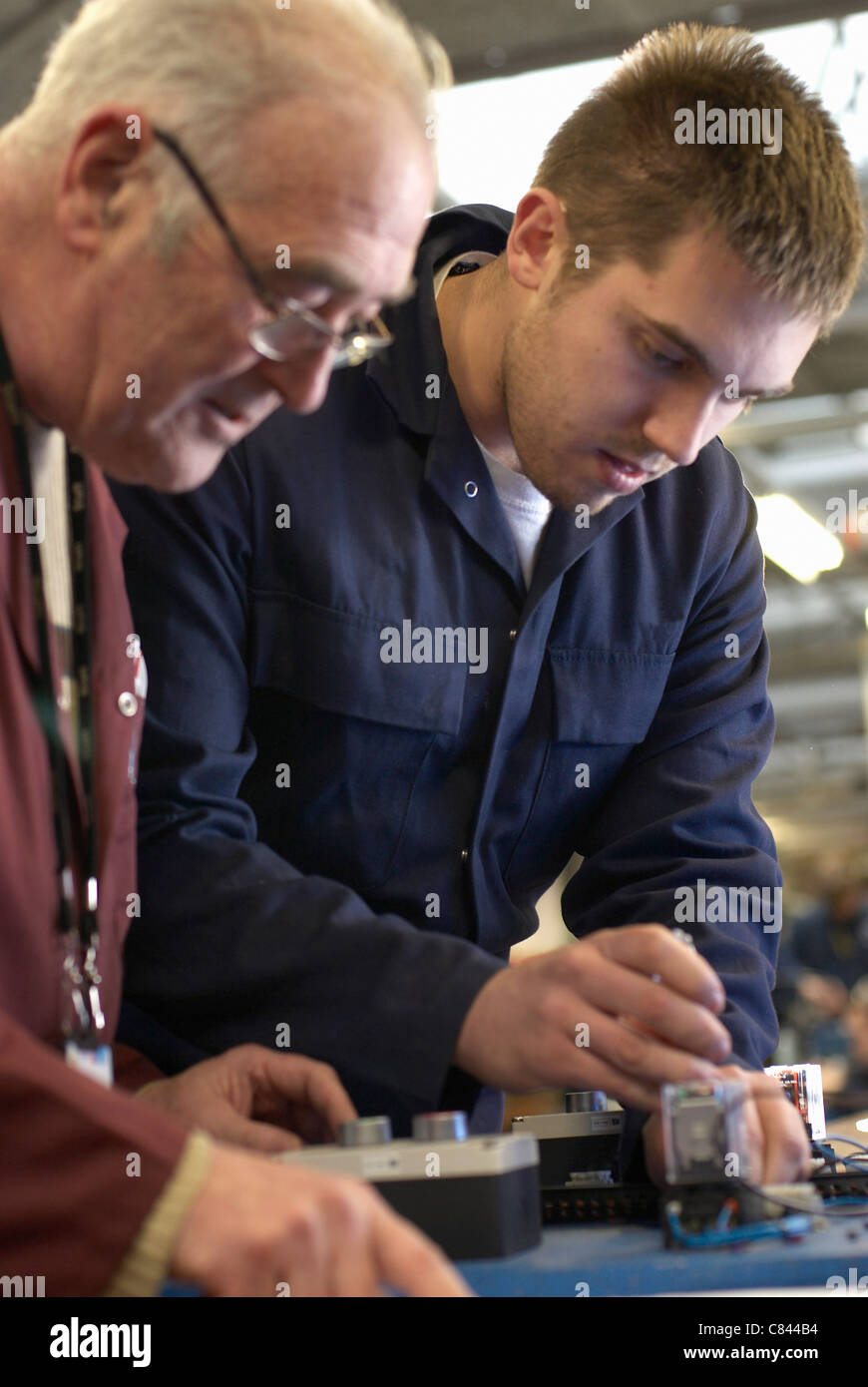 Electrical engineers working in shop Stock Photo - Alamy