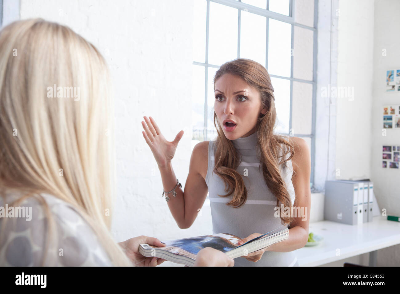 Woman fighting paperwork hi-res stock photography and images - Alamy