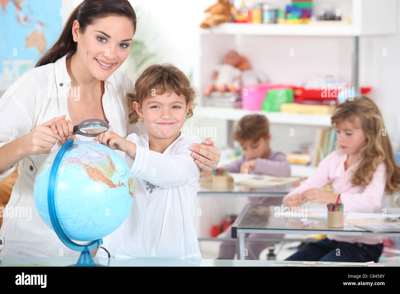 Little girls in classroom Stock Photo - Alamy