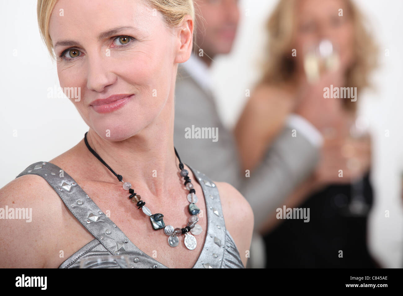 Woman hosting party Stock Photo - Alamy