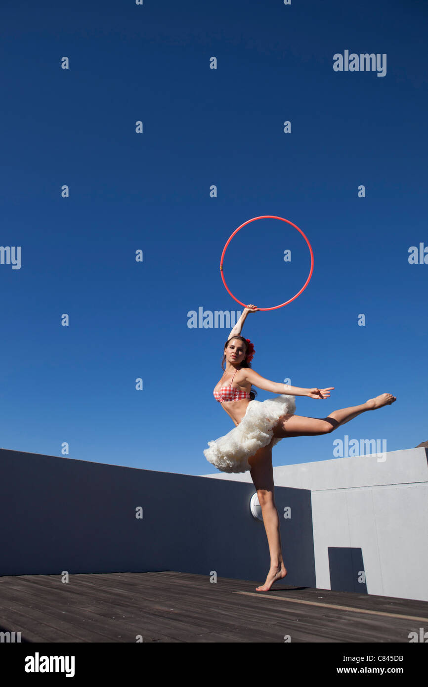 Woman in tutu dancing with hula hoop Stock Photo - Alamy