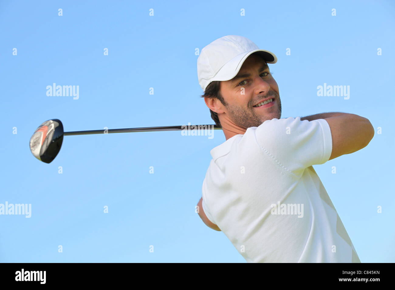 Man playing golf Stock Photo - Alamy