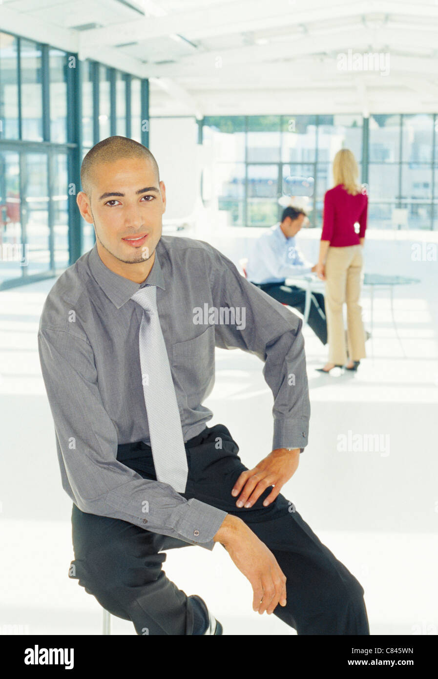 Businessman sitting in office Stock Photo - Alamy