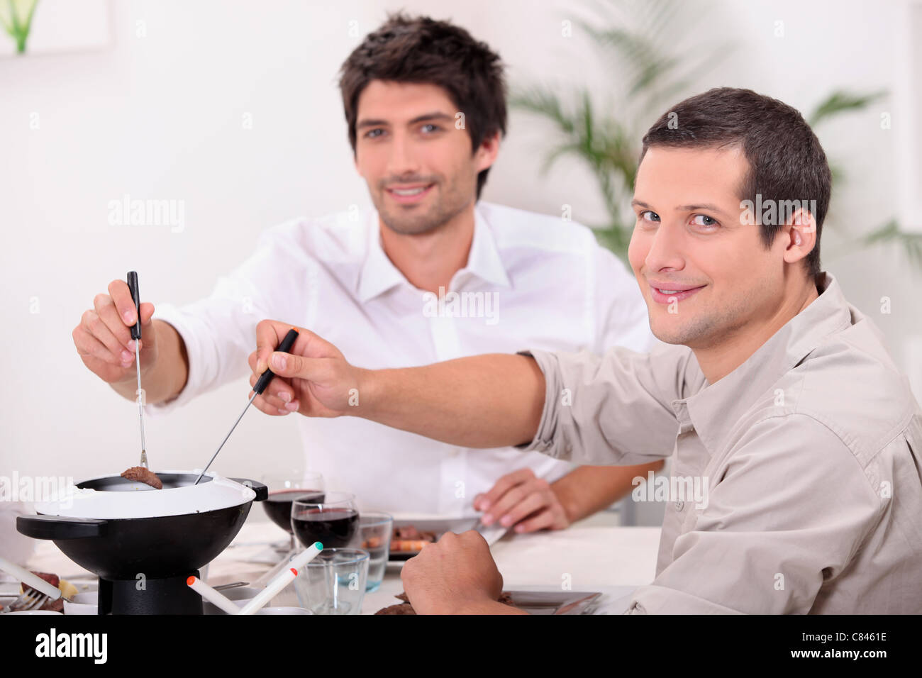 two friends having dinner Stock Photo - Alamy