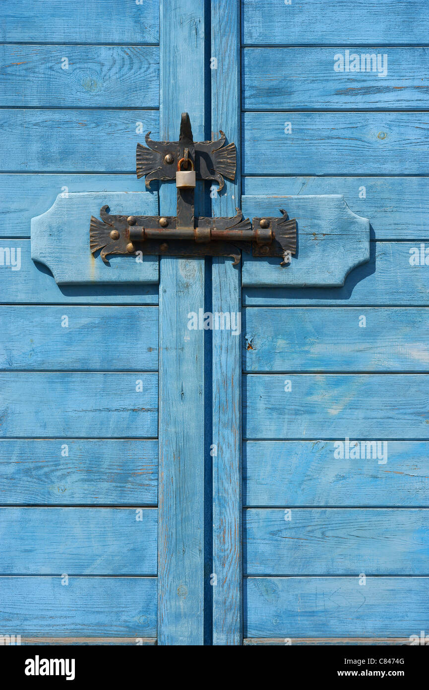 Closeup of Blue bolted shut door it blue - Locked Stock Photo - Alamy