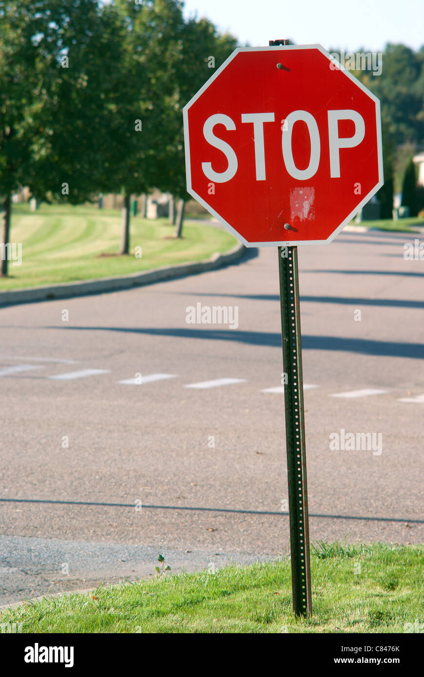 Stop sign at a street corner during summer time Stock Photo - Alamy