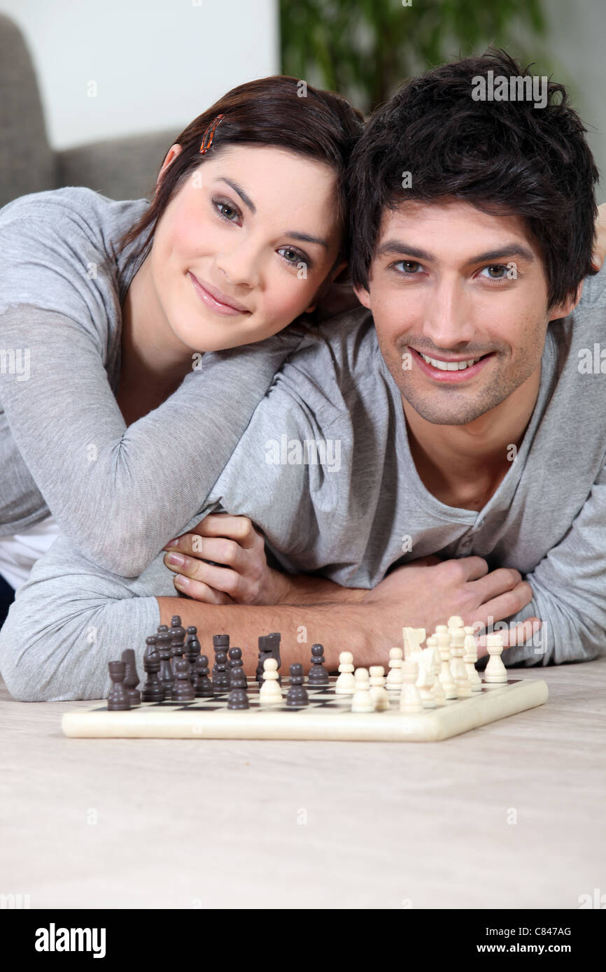 Couple playing chess Stock Photo - Alamy