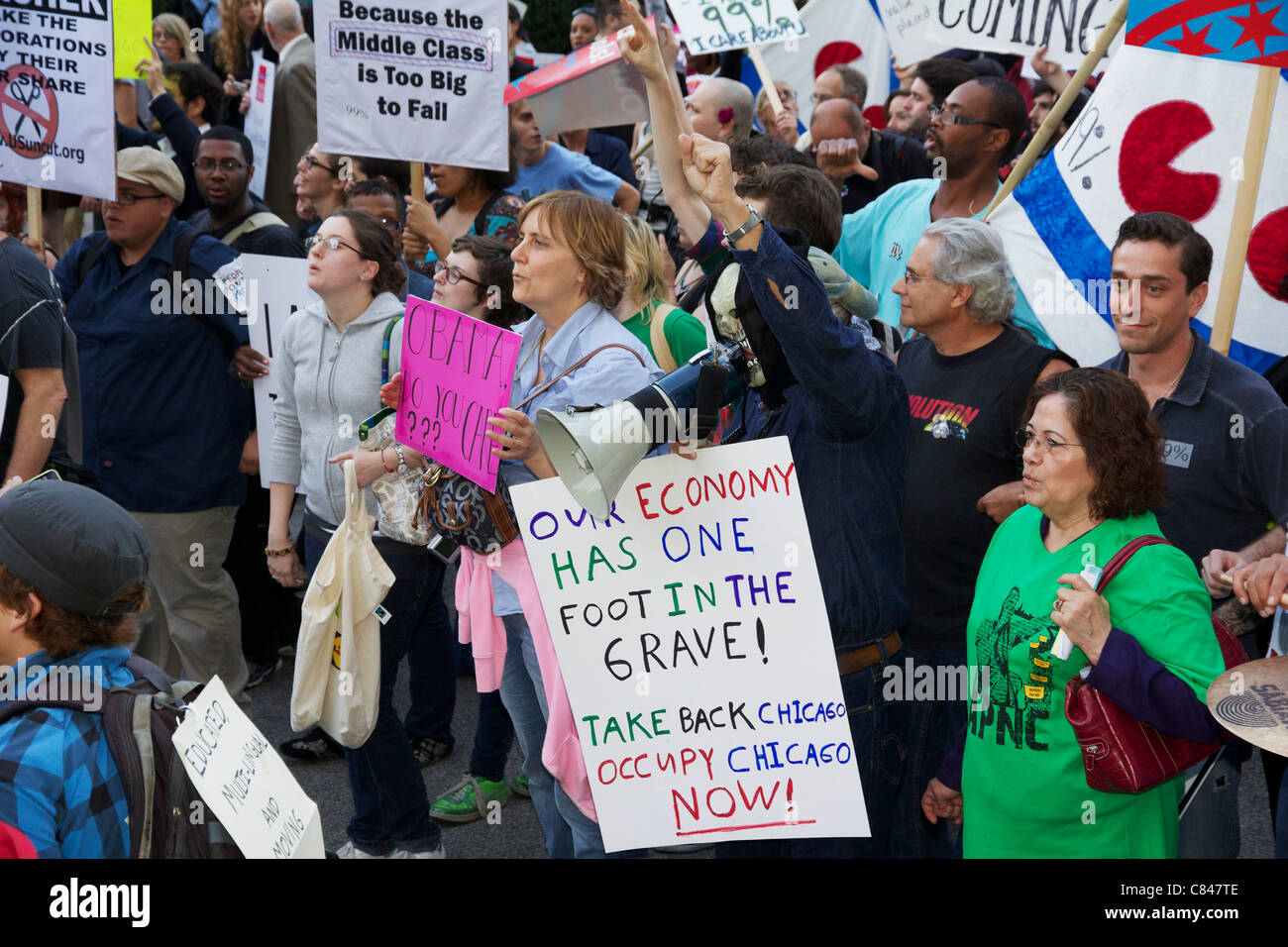 Protesters marching on Michigan Avenue. Occupy Chicago protest Stock ...