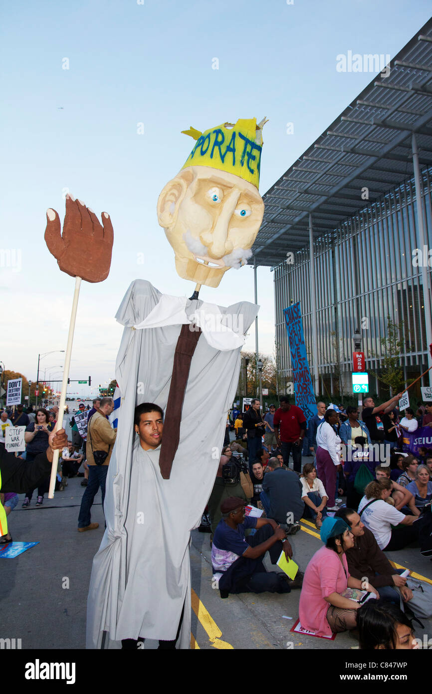 Man operating big "Corporate Welfare" puppet Stock Photo - Alamy