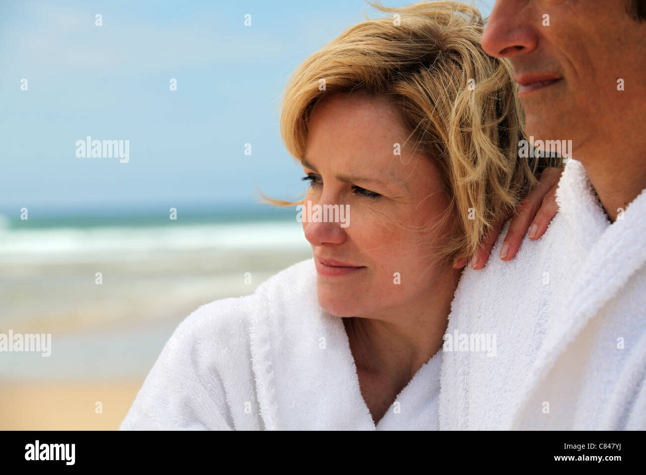 Couple at the seaside Stock Photo - Alamy