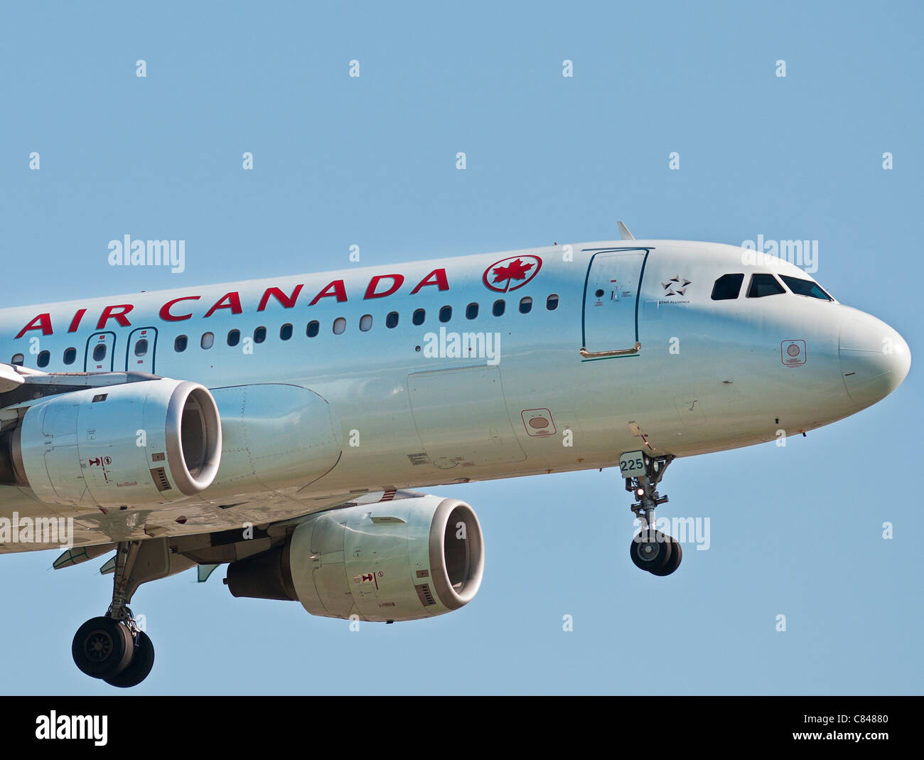 A close up view of an Air Canada passenger jet on final approach for ...