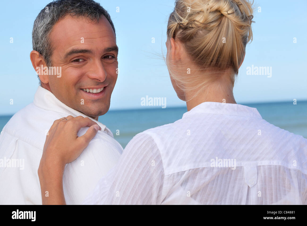 Back view couple relaxing seaside hi-res stock photography and images ...