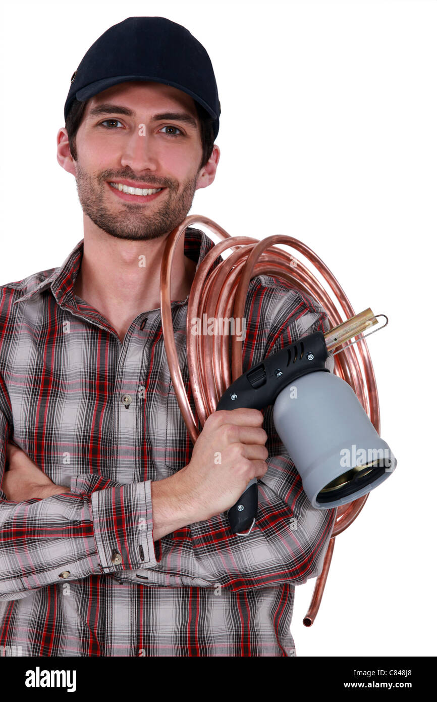 A plumber with welding gears Stock Photo - Alamy