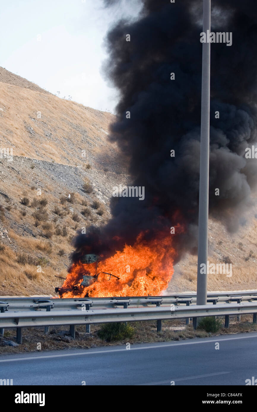 Burning van with large flames and black smoke Stock Photo - Alamy