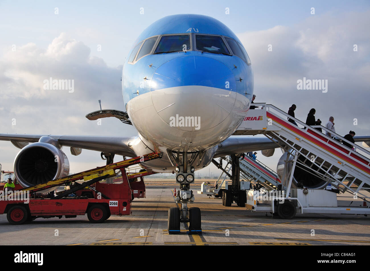 Passengers leaving Thomson Boeing 757-204 aircraft at Reus Airport ...