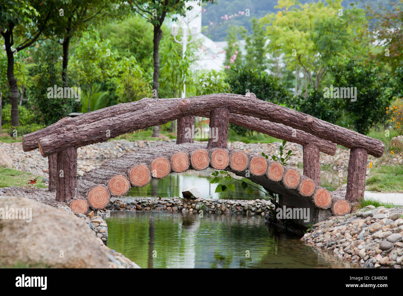 Footbridge in a Chinese natural garden Stock Photo - Alamy