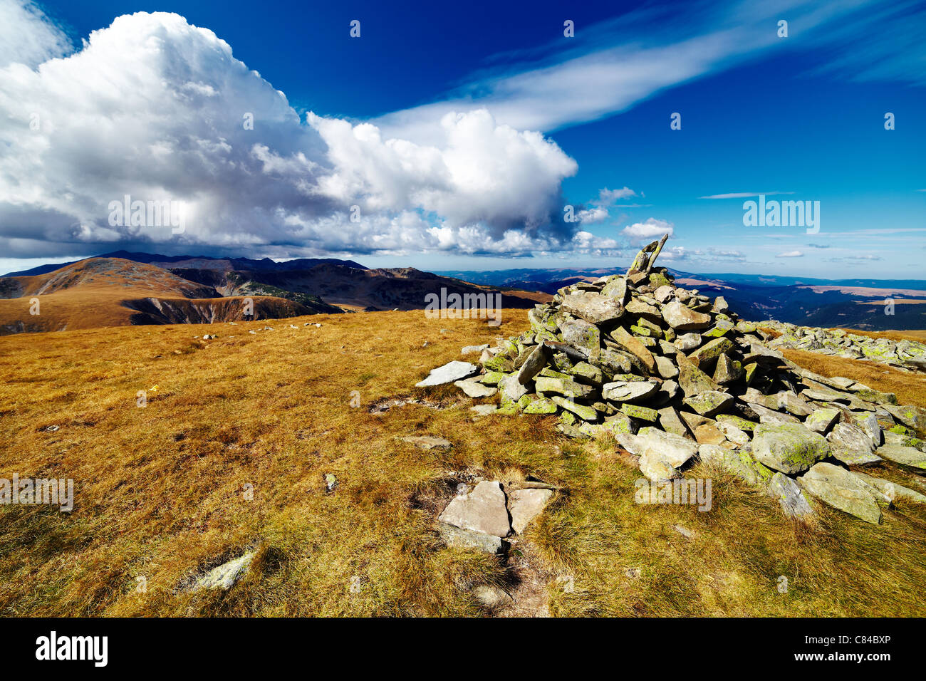 Pile of rocks marking the Mohoru peak of Parang mountains in Romania ...
