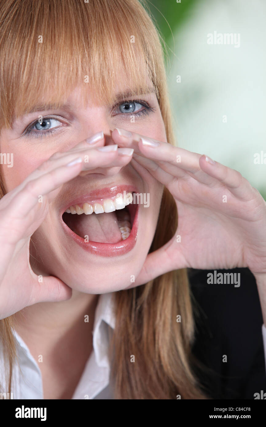 Portrait of a young woman screaming Stock Photo - Alamy