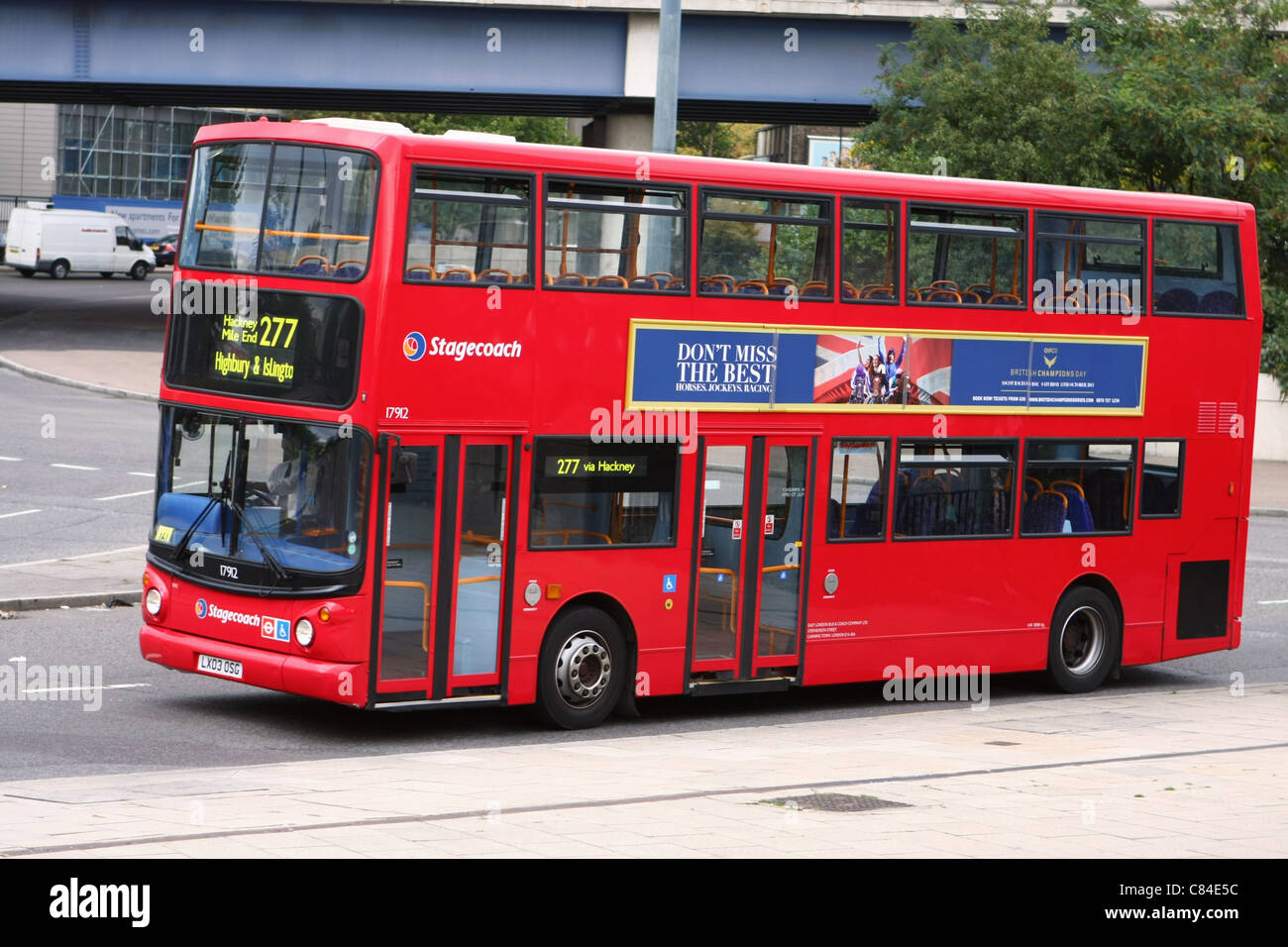 a double decker red London bus traveling in London Stock Photo - Alamy