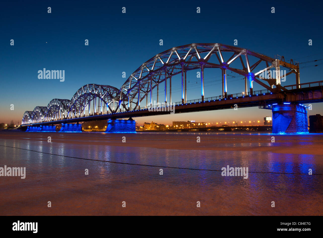 Railway bridge at night in winter close up Stock Photo - Alamy
