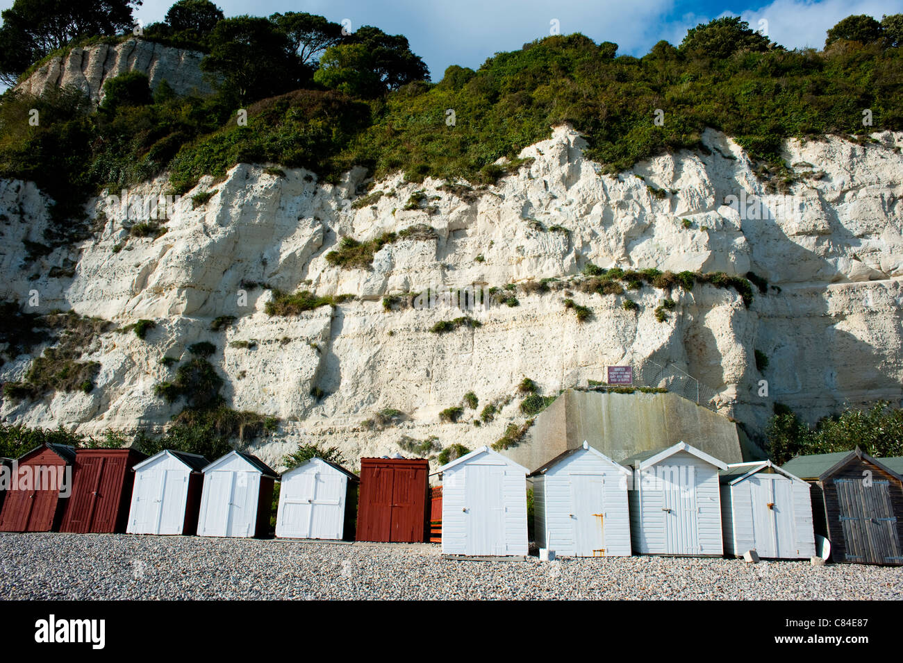 Beach huts and white cliffs at Beer, Devon, England Stock Photo - Alamy
