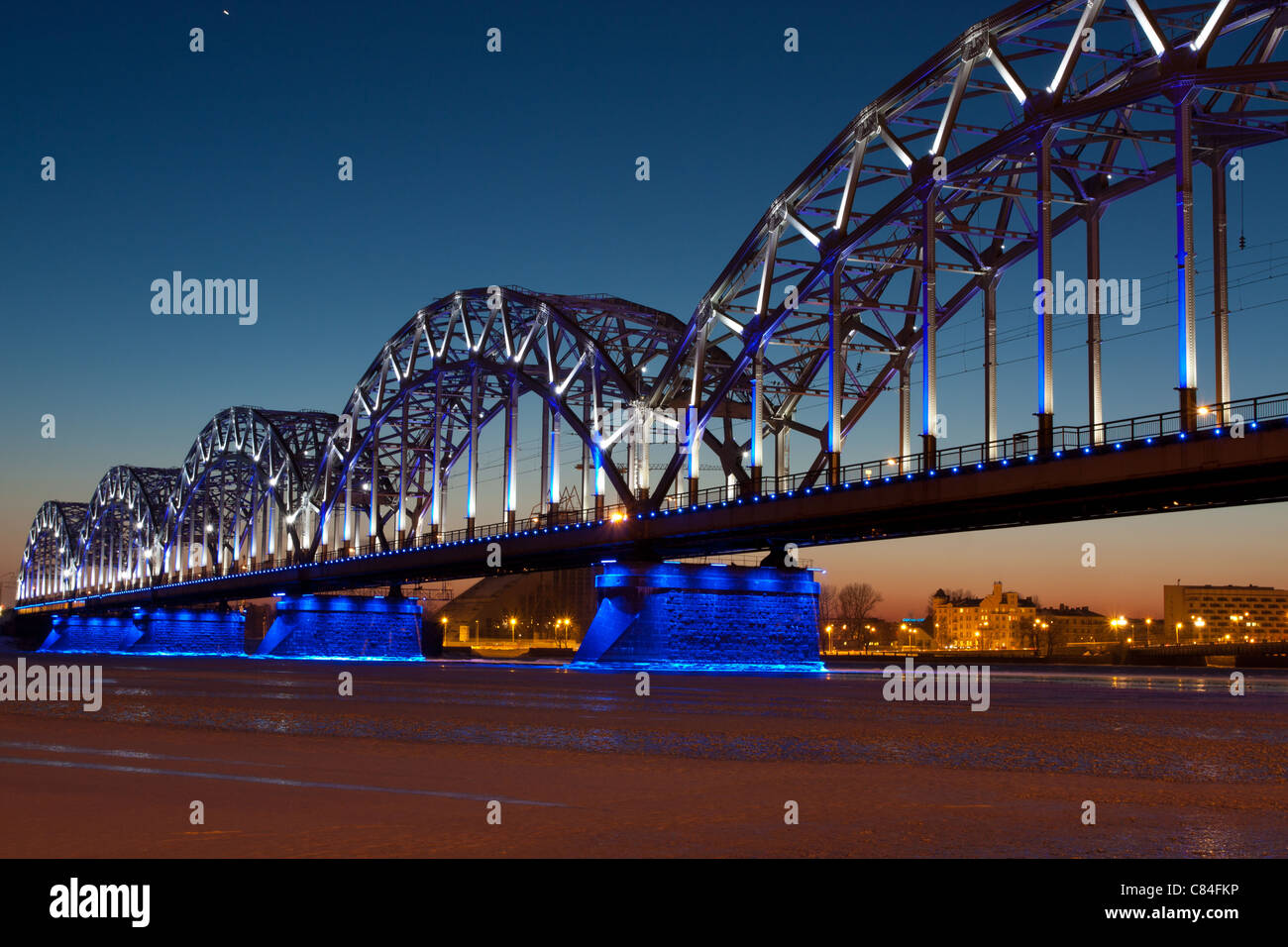 Railway bridge at night in winter close up Stock Photo - Alamy