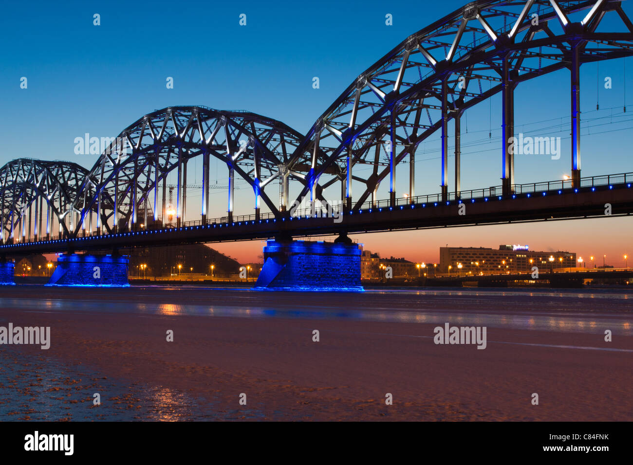 Railway bridge at night in winter close up Stock Photo - Alamy