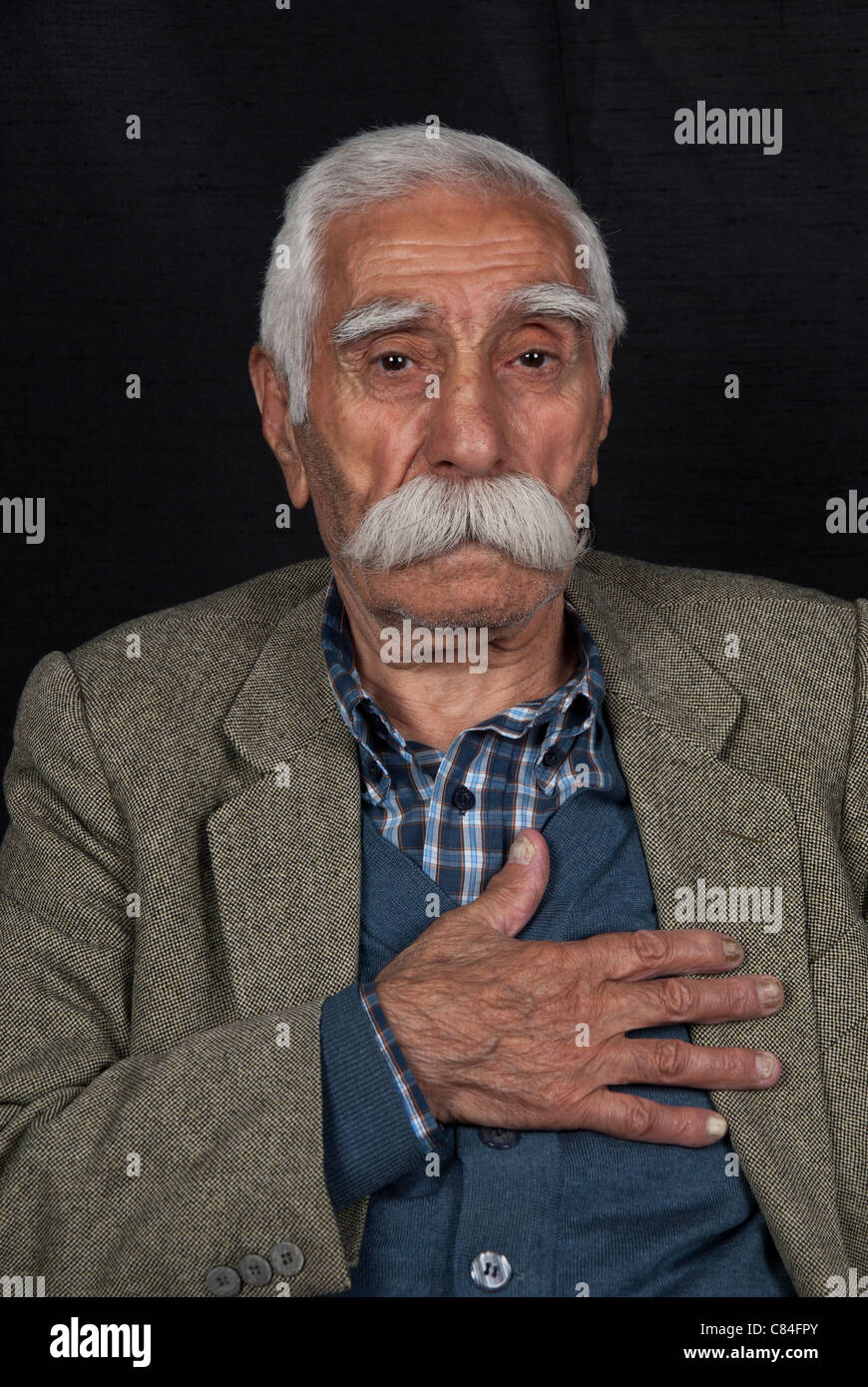 PORTRAIT OF ELDERLY TURKISH ALAWITE MALE HOLDING HIS HAN ON HIS CHEST ...