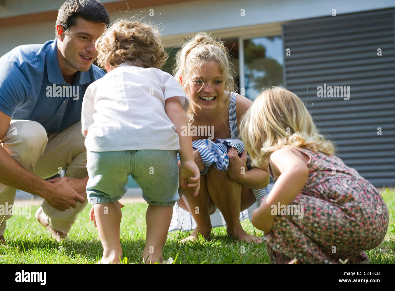 Family playing together outdoors Stock Photo - Alamy